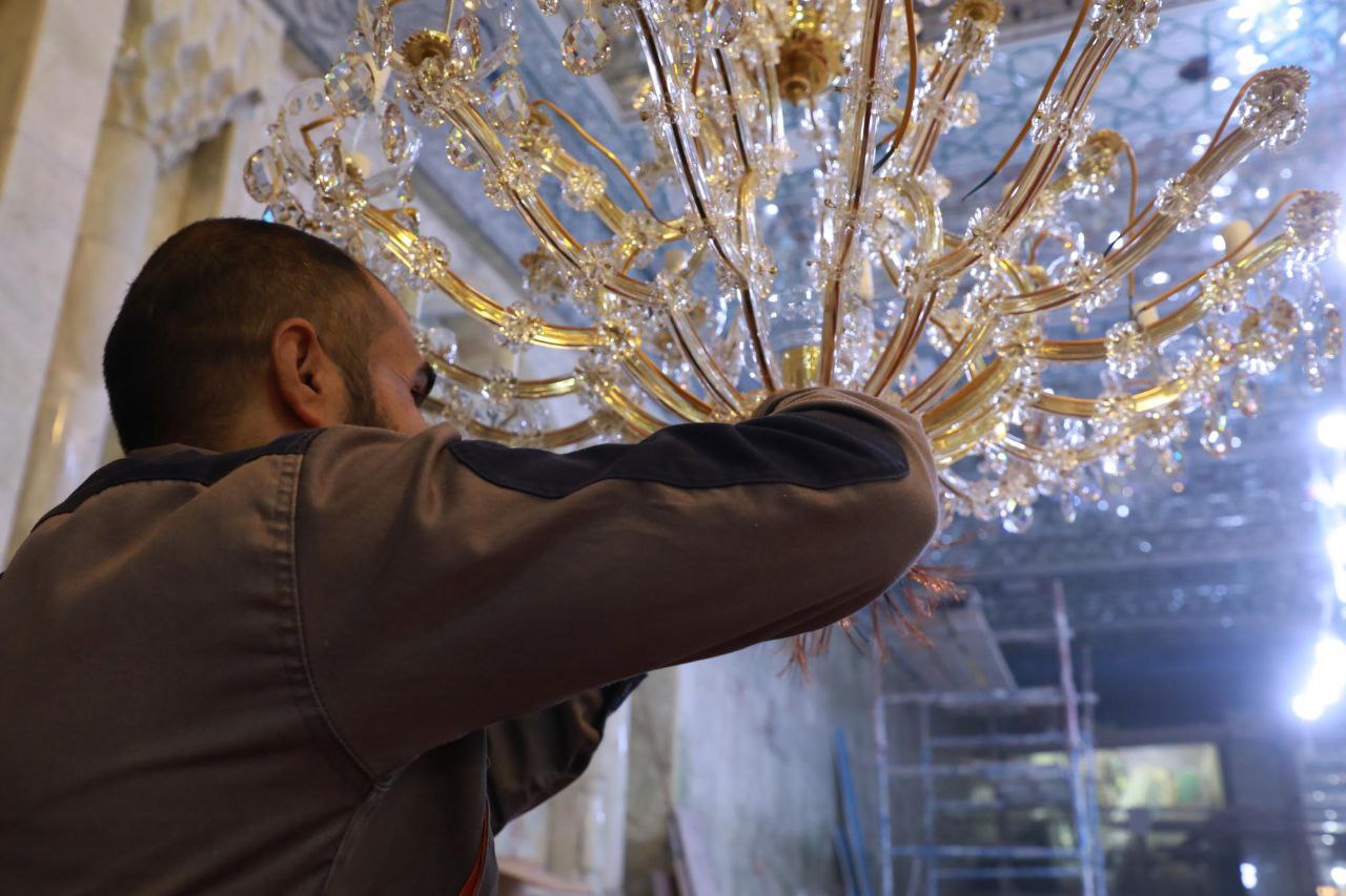 New chandeliers decorate the ceiling of the Basement of Imam Hussein ...