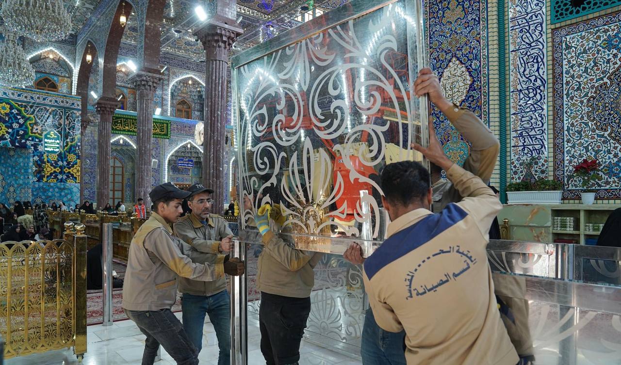 Employees at Imam Hussein Holy Shrine install partitions to organize ...